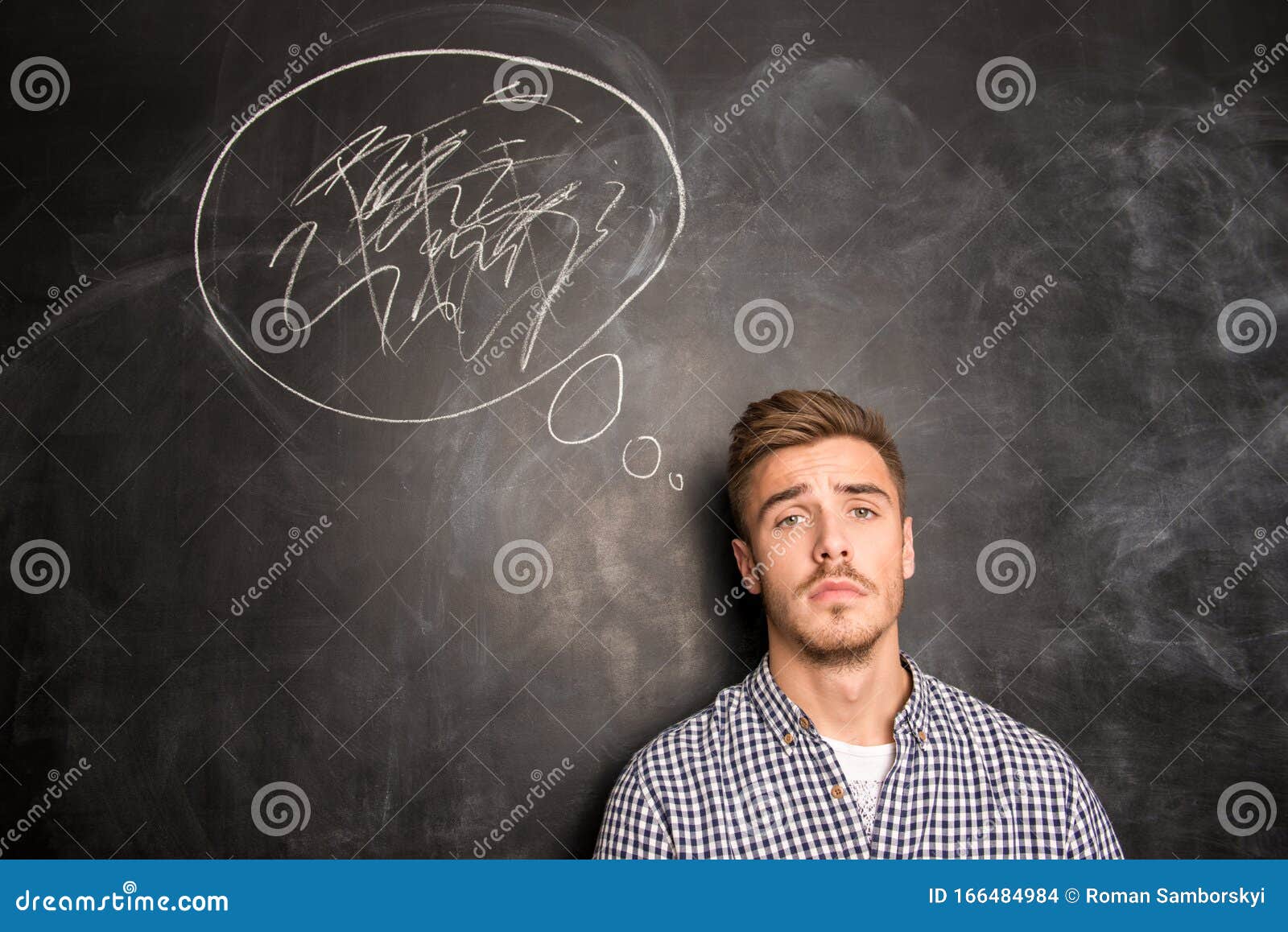 Young Man Against the Background of Chalkboard Solving a Problem Stock ...