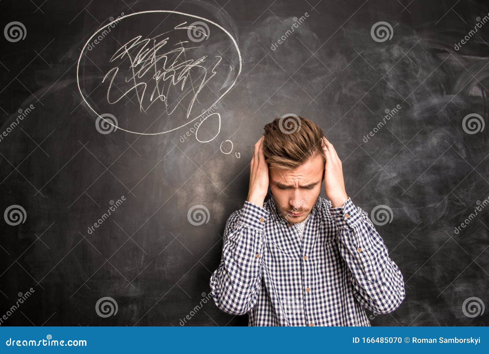Young Man Against the Background of Chalkboard Solving a Problem Stock ...