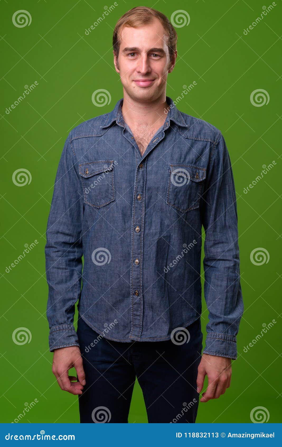 Young Man Against Green Background Stock Image - Image of screen, shirt ...