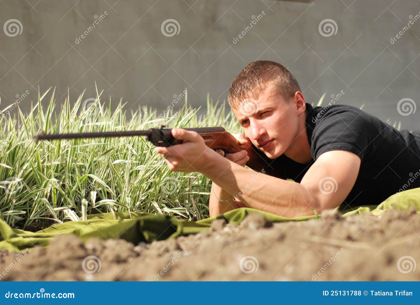 Young man aiming stock photo. Image of focused, hunt - 25131788