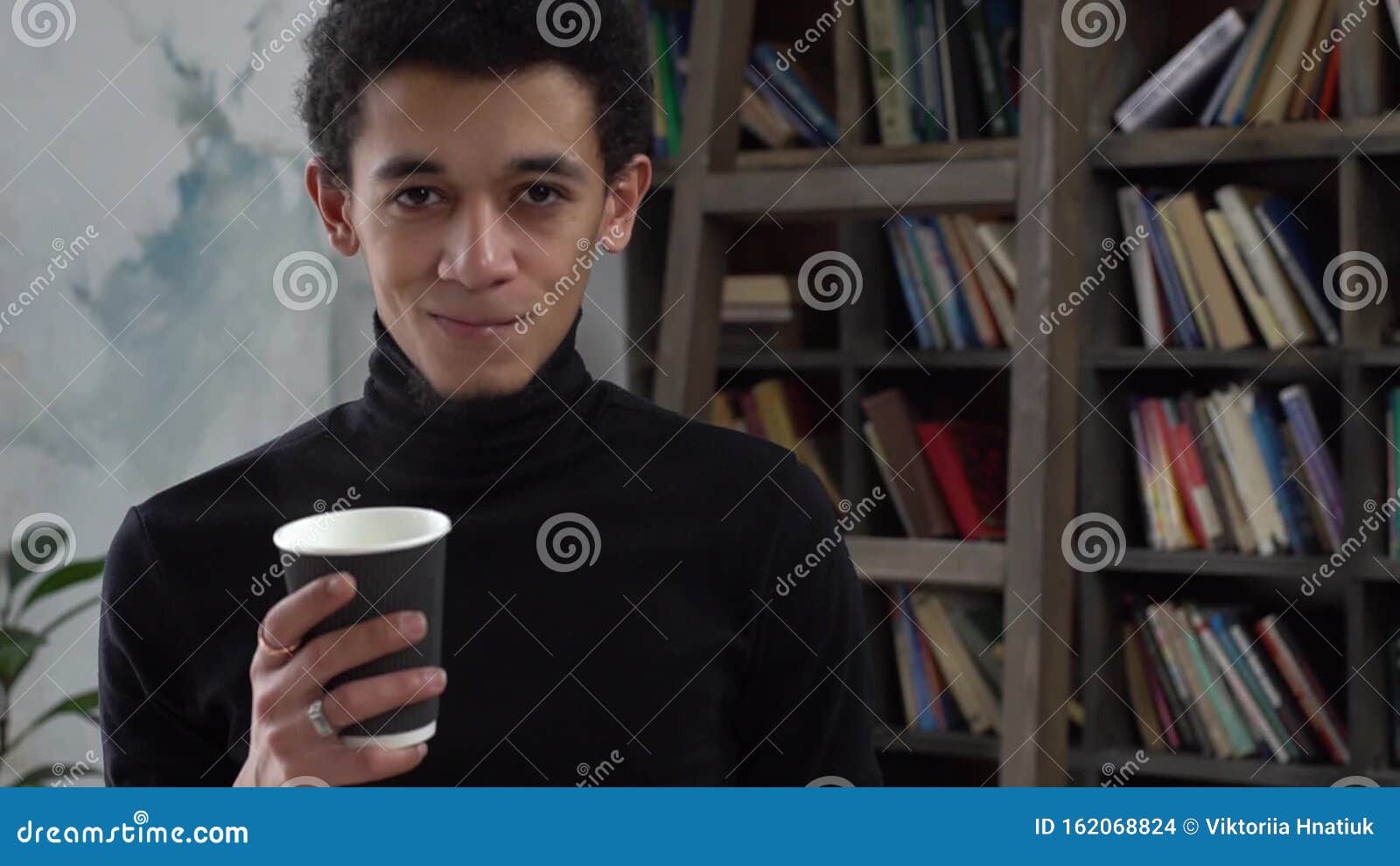 Young Man Alone in Library Drinking Coffee Smiling Joyful Stock Footage ...
