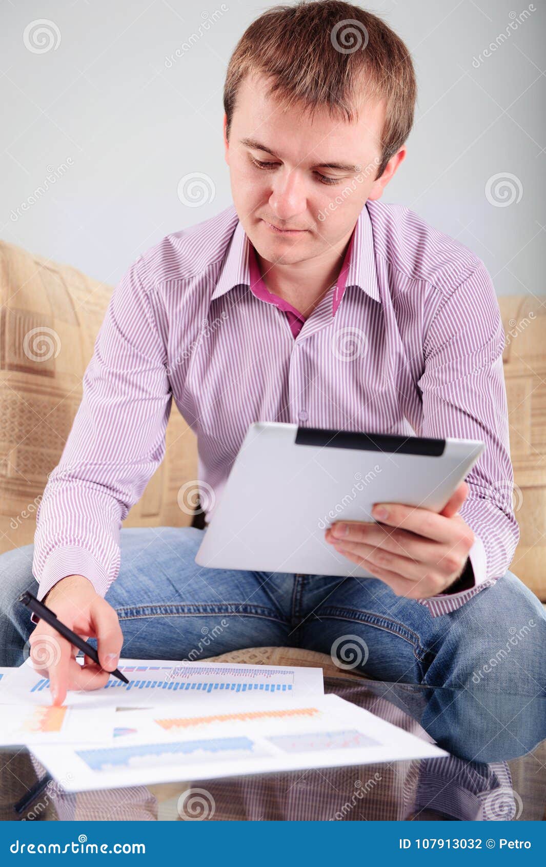 Young man analyzing charts stock photo. Image of chart - 107913032