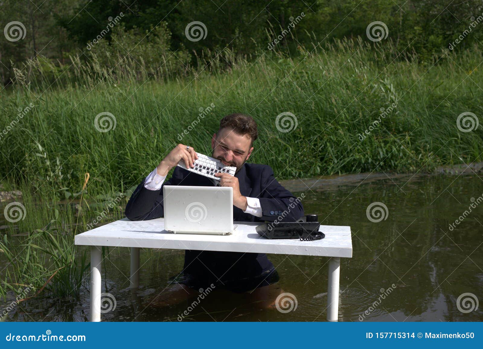 A Young Man is Nervous and Bites the Keyboard. Gnaws at the Keyboard ...
