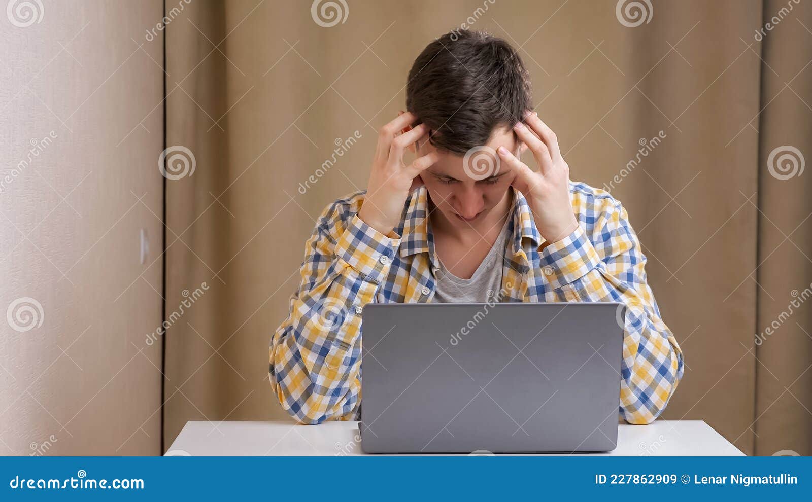 Young Man Angry Typing on Laptop at Table Stock Image - Image of ...