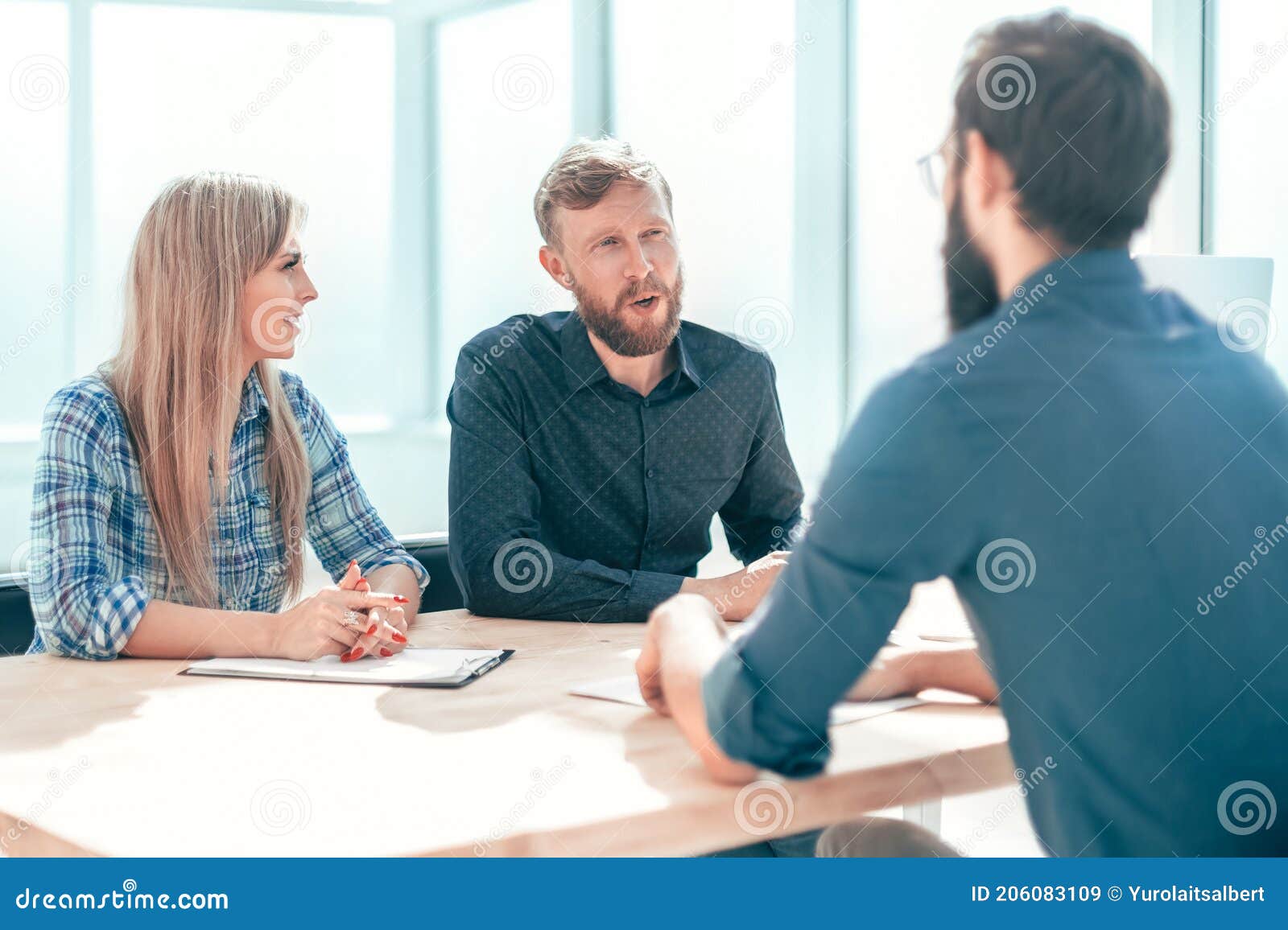 Young Man Answering Questions from Managers during an Interview. Stock ...