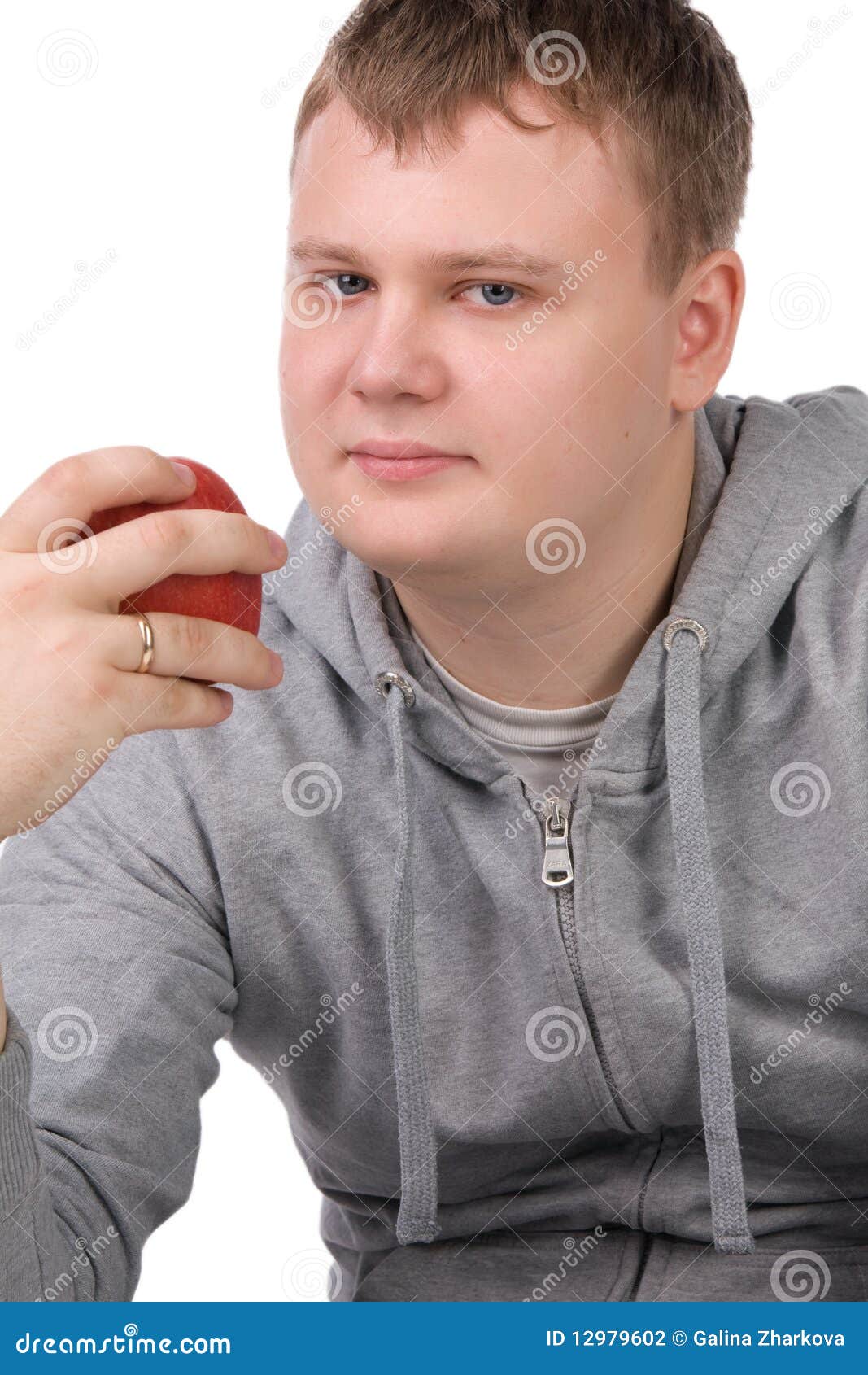 Young man with apple stock photo. Image of white, hold - 12979602
