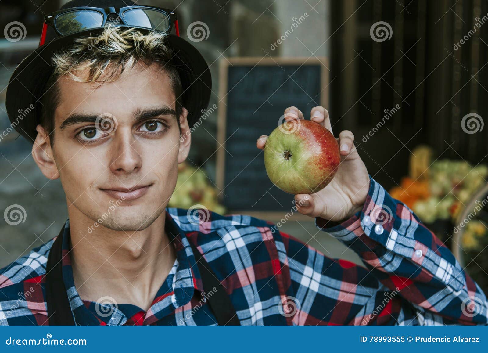 Young man with apple stock image. Image of products, italy - 78993555