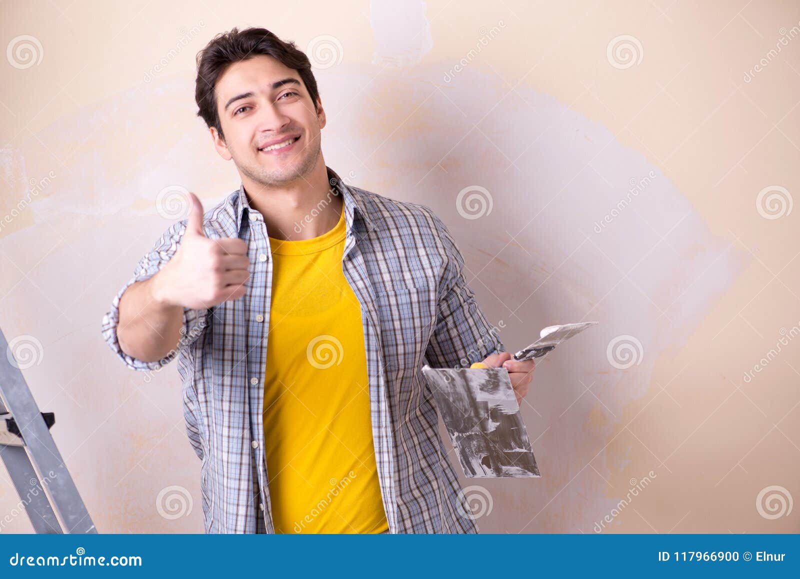 The Young Man Applying Plaster on Wall at Home Stock Photo - Image of ...