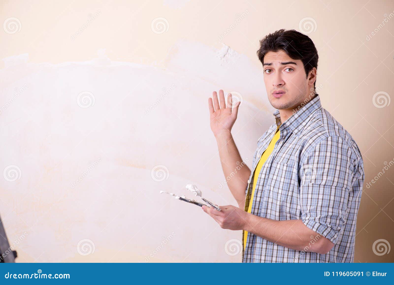 The Young Man Applying Plaster on Wall at Home Stock Image - Image of ...