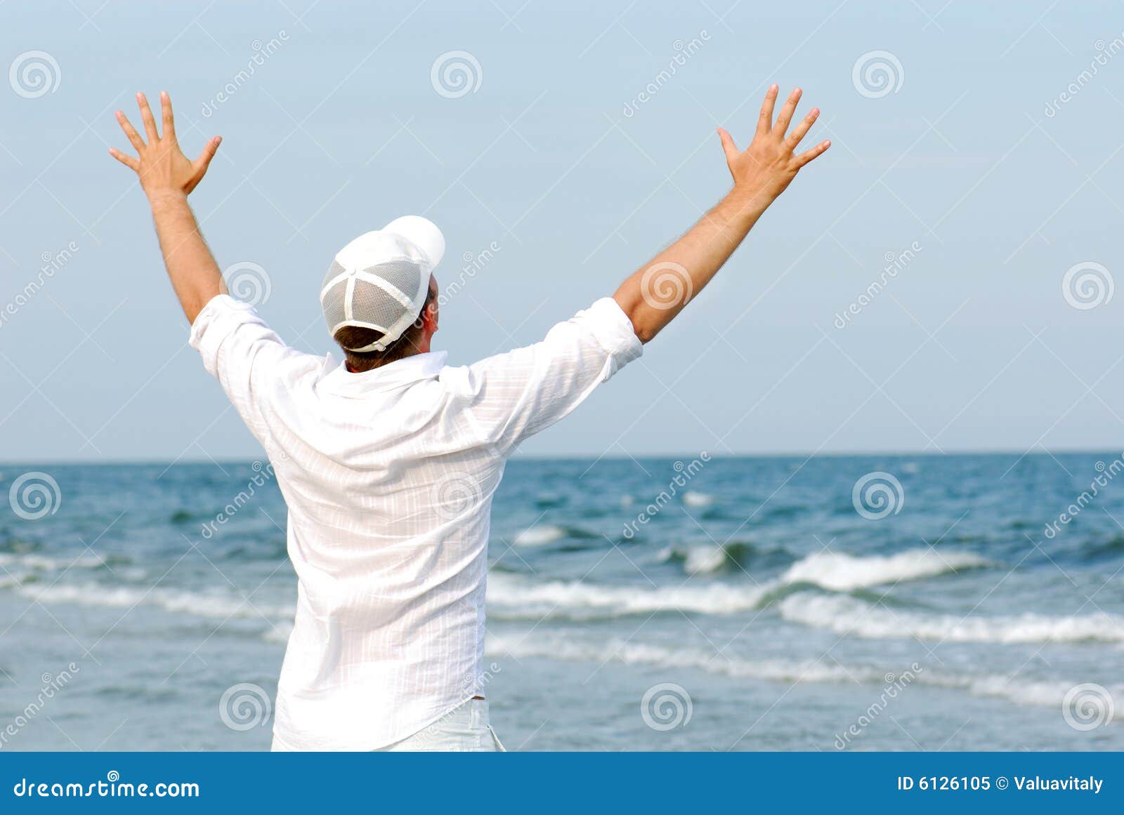 Young man with arms raised stock image. Image of adult - 6126105