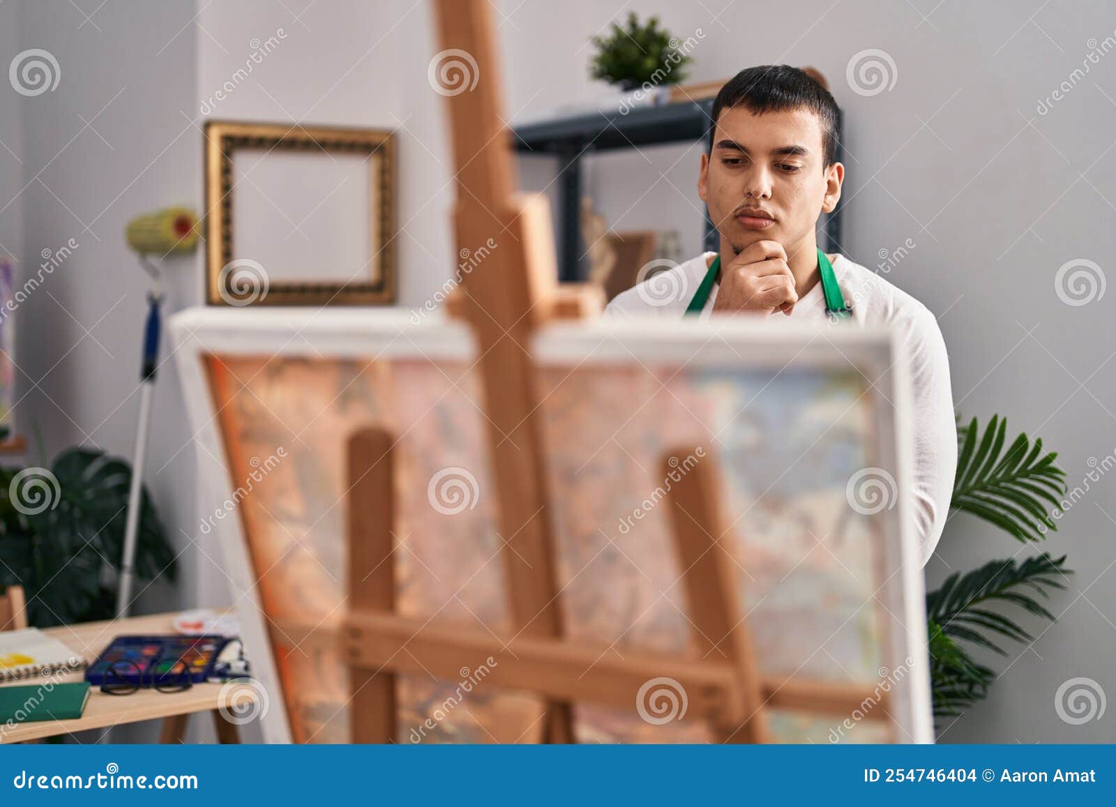 Young Man Artist Looking Draw with Doubt Expression at Art Studio Stock ...