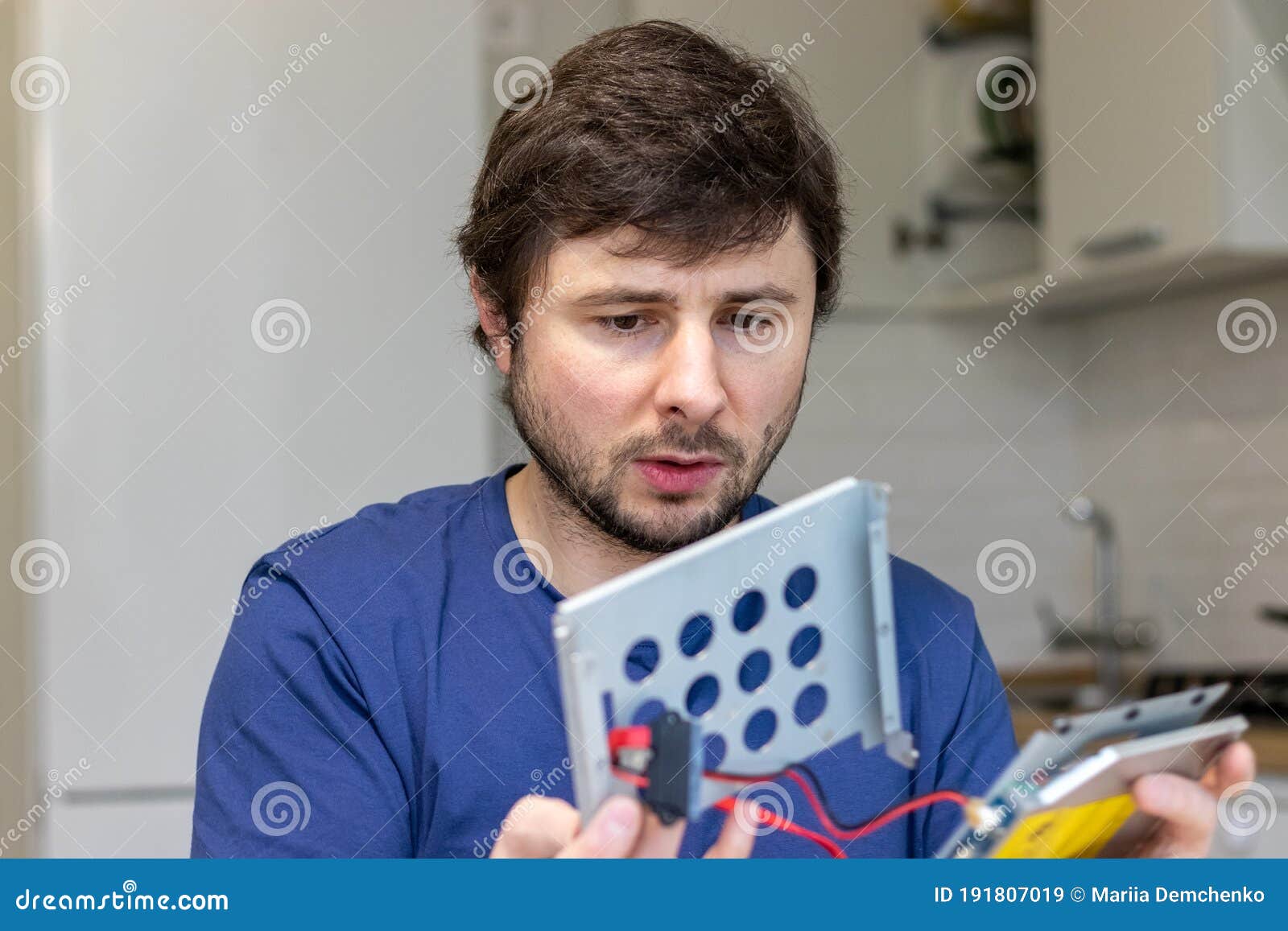 Young Man Assembles Electronic Computer Components with His Own Hands ...