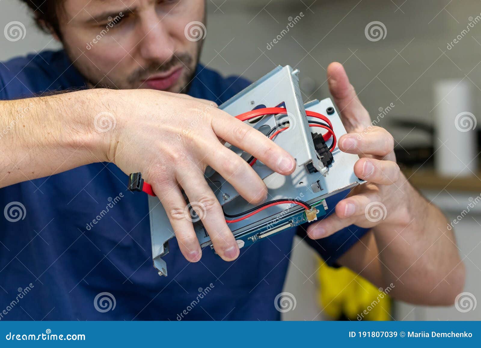 Young Man Assembles Electronic Computer Components with His Own Hands ...