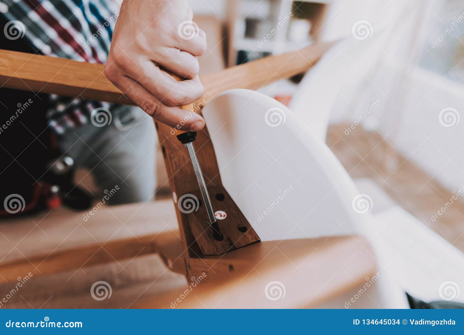Young Man Assembling Coffee Table and Stools Stock Photo - Image of ...