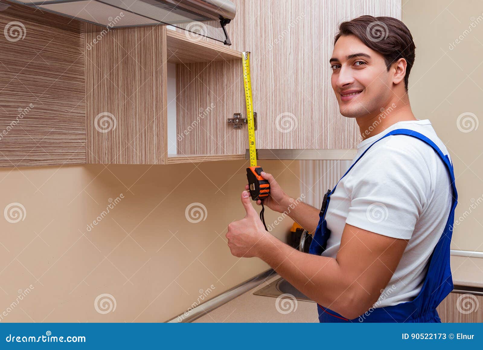 The Young Man Assembling Kitchen Furniture Stock Image - Image of ...