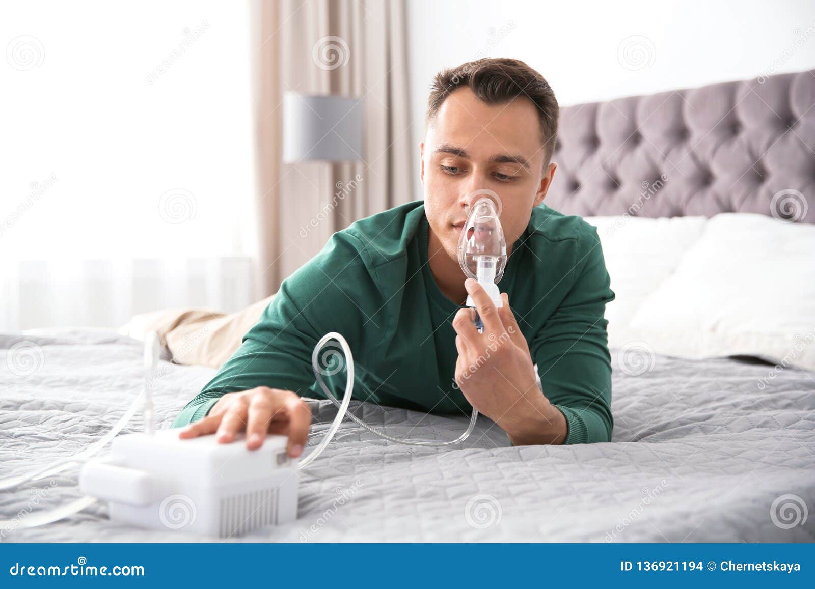 Young Man with Asthma Machine on Bed Stock Photo - Image of light ...