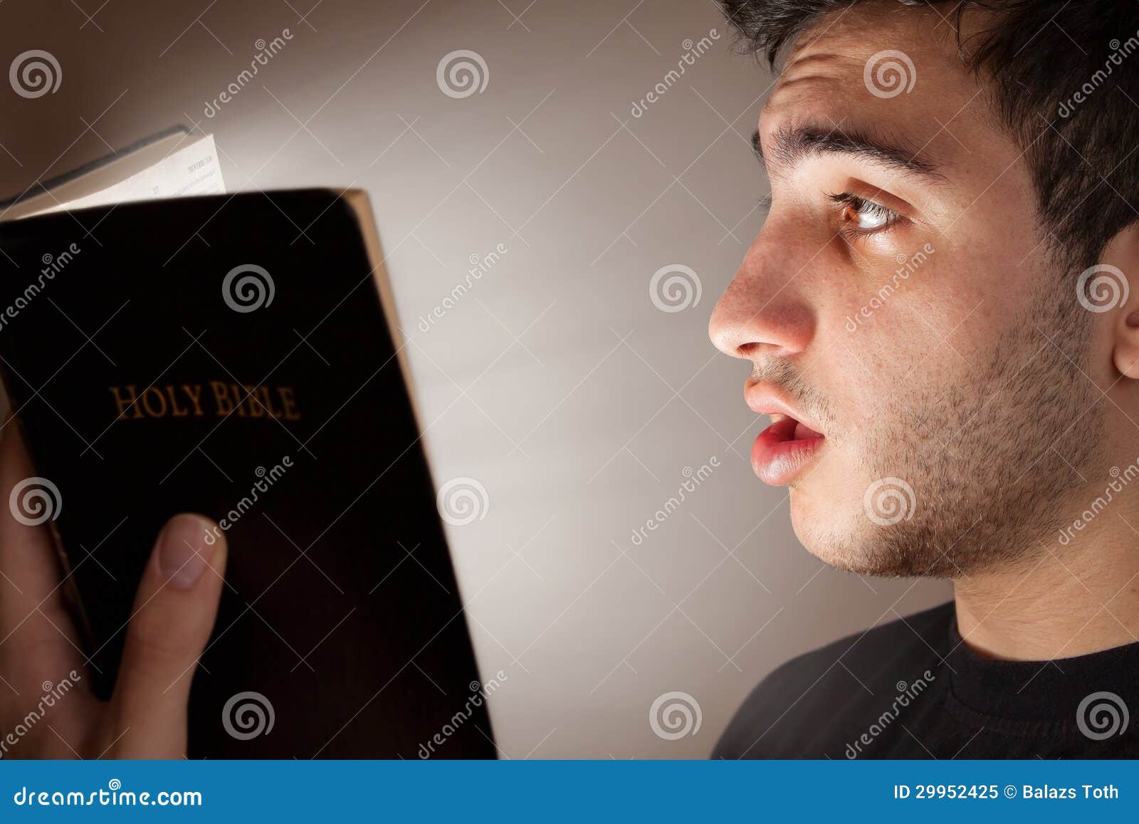 Man Reading Bible In Amazement Stock Image - Image of enjoy, meditating ...