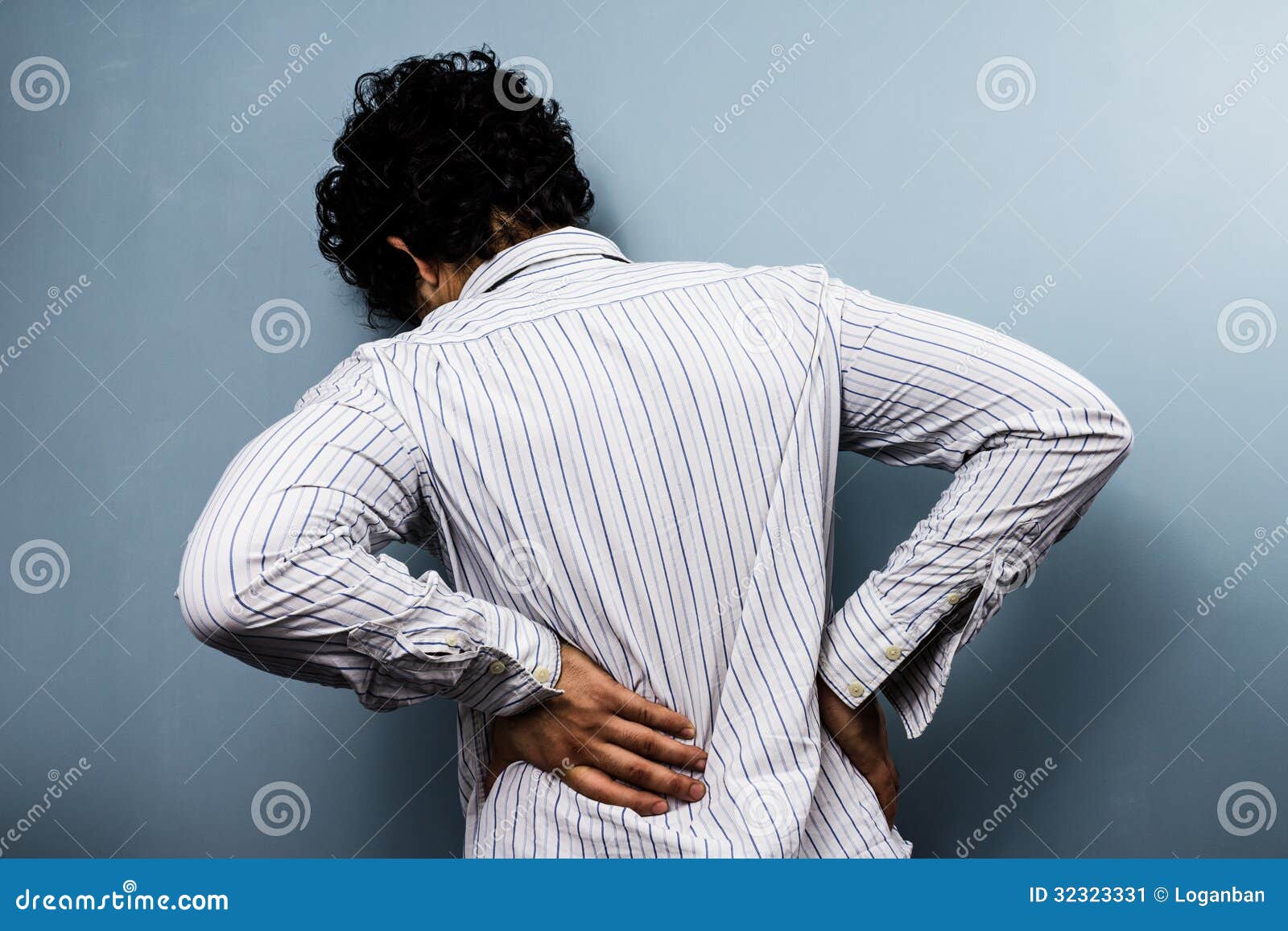 Young man with back pain stock image. Image of beauty - 32323331