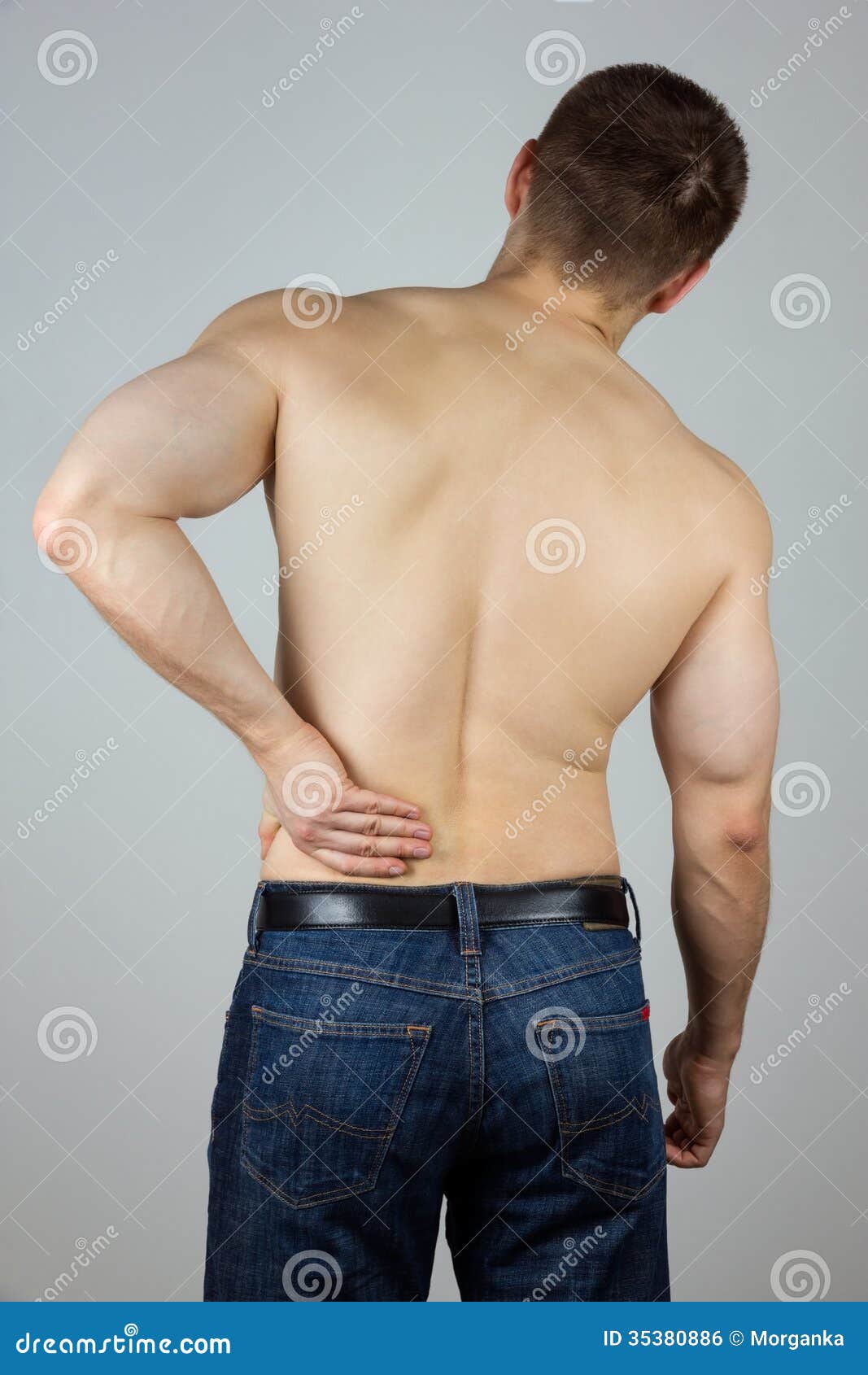 Young man with back pain stock photo. Image of head, male - 35380886