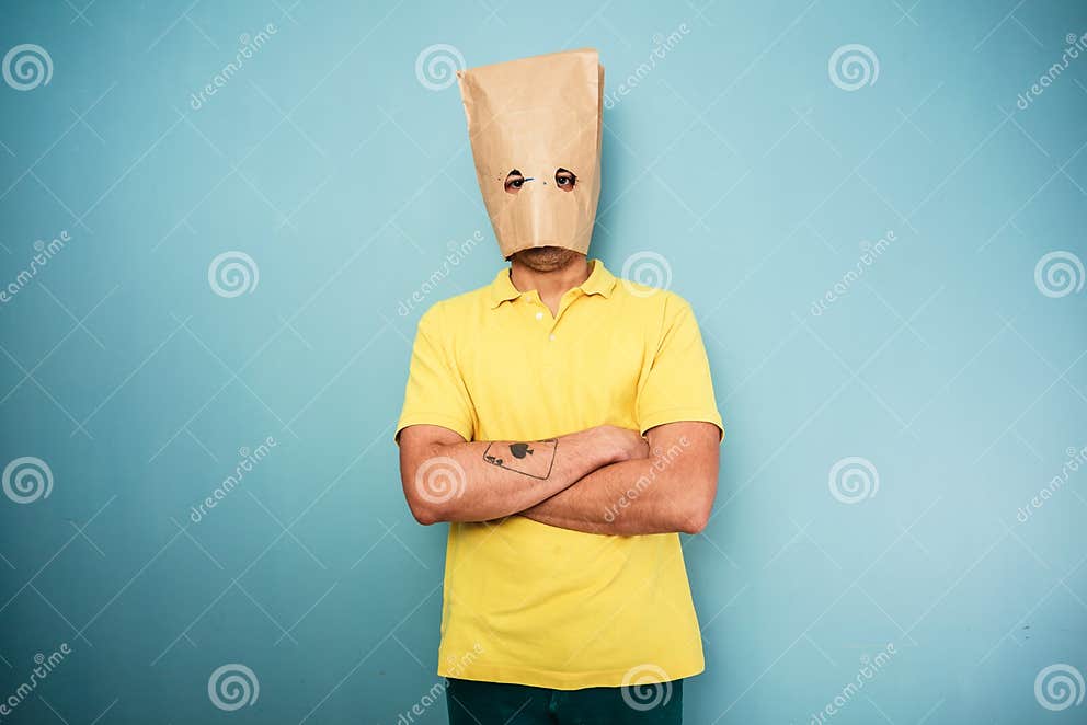 Young Man with Bag Over Head Stock Image - Image of defiant, blue: 37846409