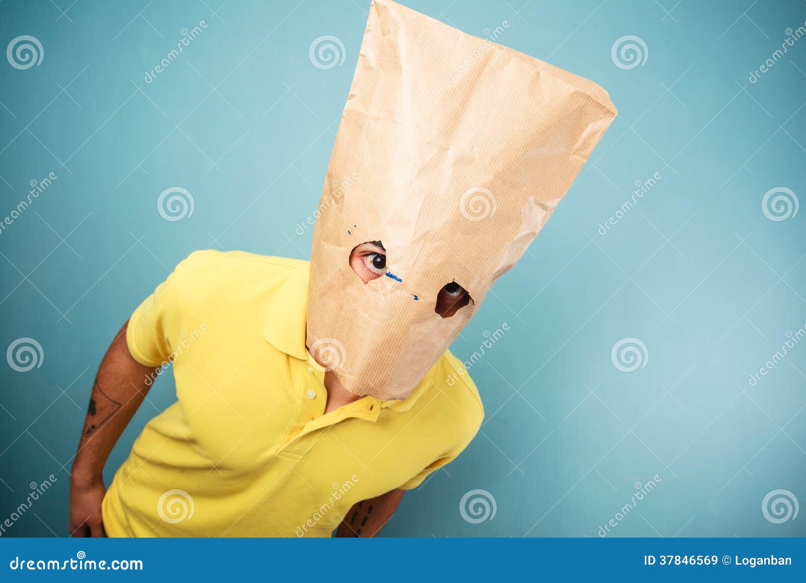 Young Man with Bag Over Head Looking at Camera Stock Image - Image of ...