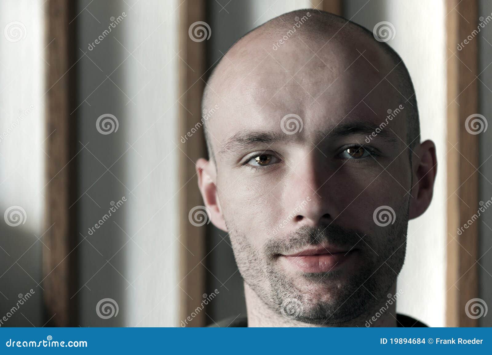 Young man with a bald head stock photo. Image of eyes - 19894684