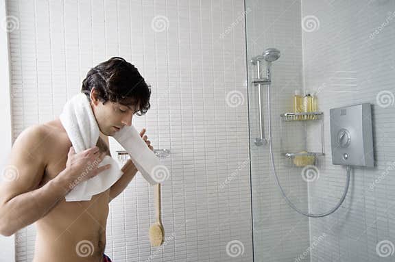 Young man in bathroom stock photo. Image of indoors, routine - 29667532