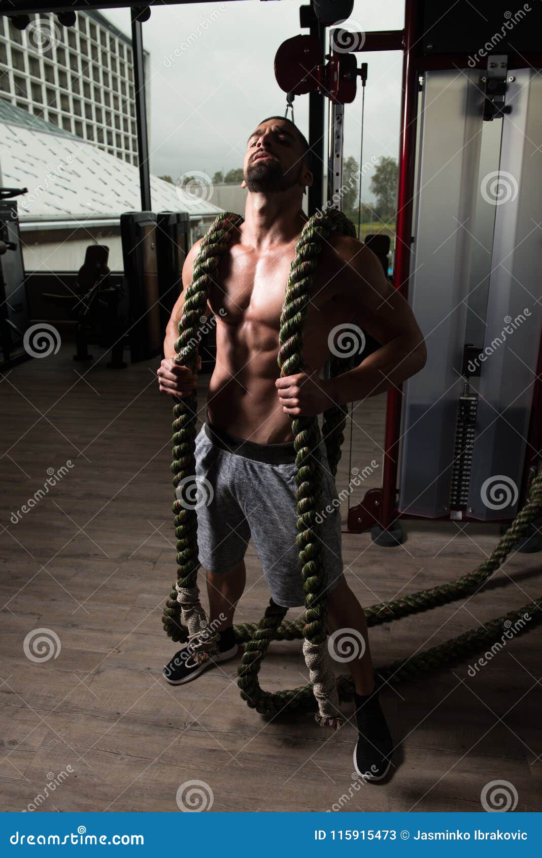 Young Man Battling Ropes at Gym Workout Exercise Stock Image - Image of ...