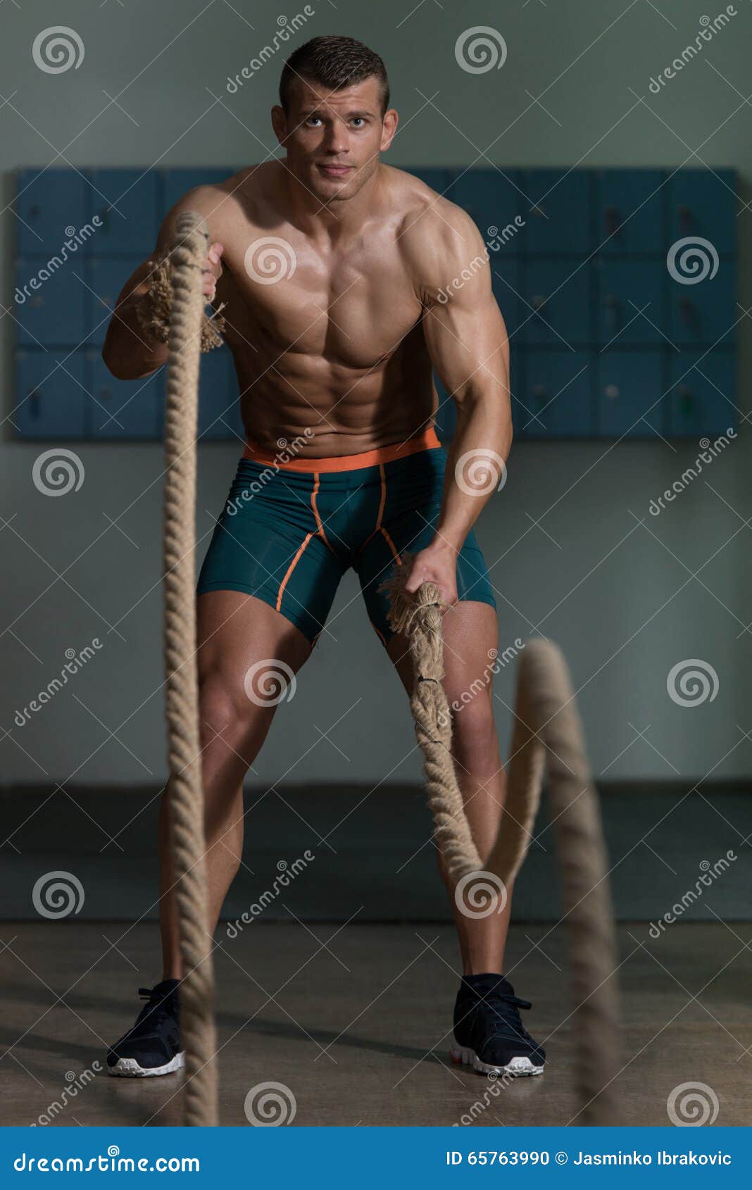 Young Man Battling Ropes at Gym Workout Exercise Stock Photo - Image of ...