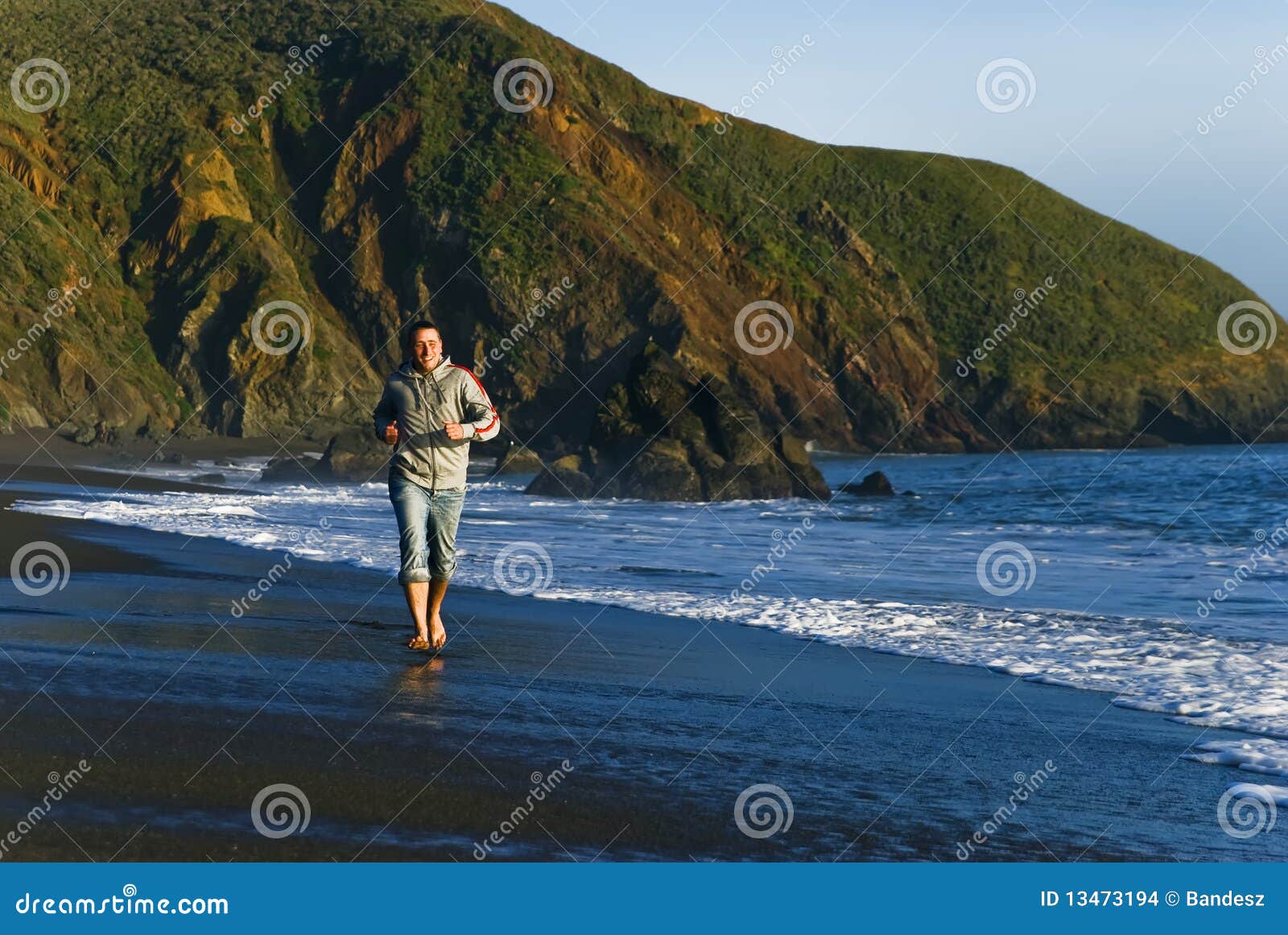 Young man beach run stock photo. Image of happy, attractive - 13473194