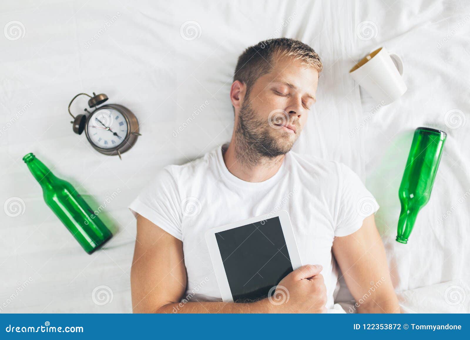 Young Man in Bed the Morning after Night Out Drinking Stock Photo ...