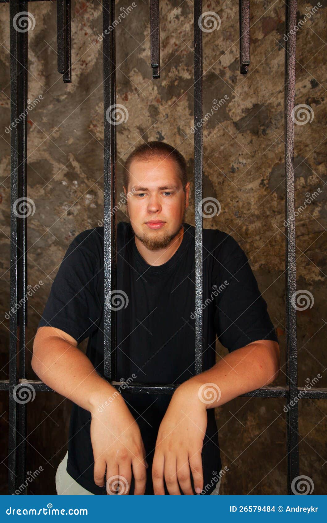Young man behind the bars stock photo. Image of prison - 26579484