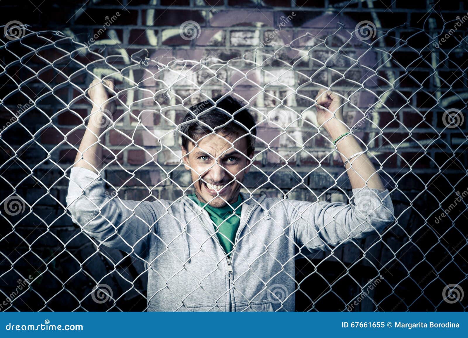 A Young Man Behind Bars Close Stock Image - Image of eyes, help: 67661655