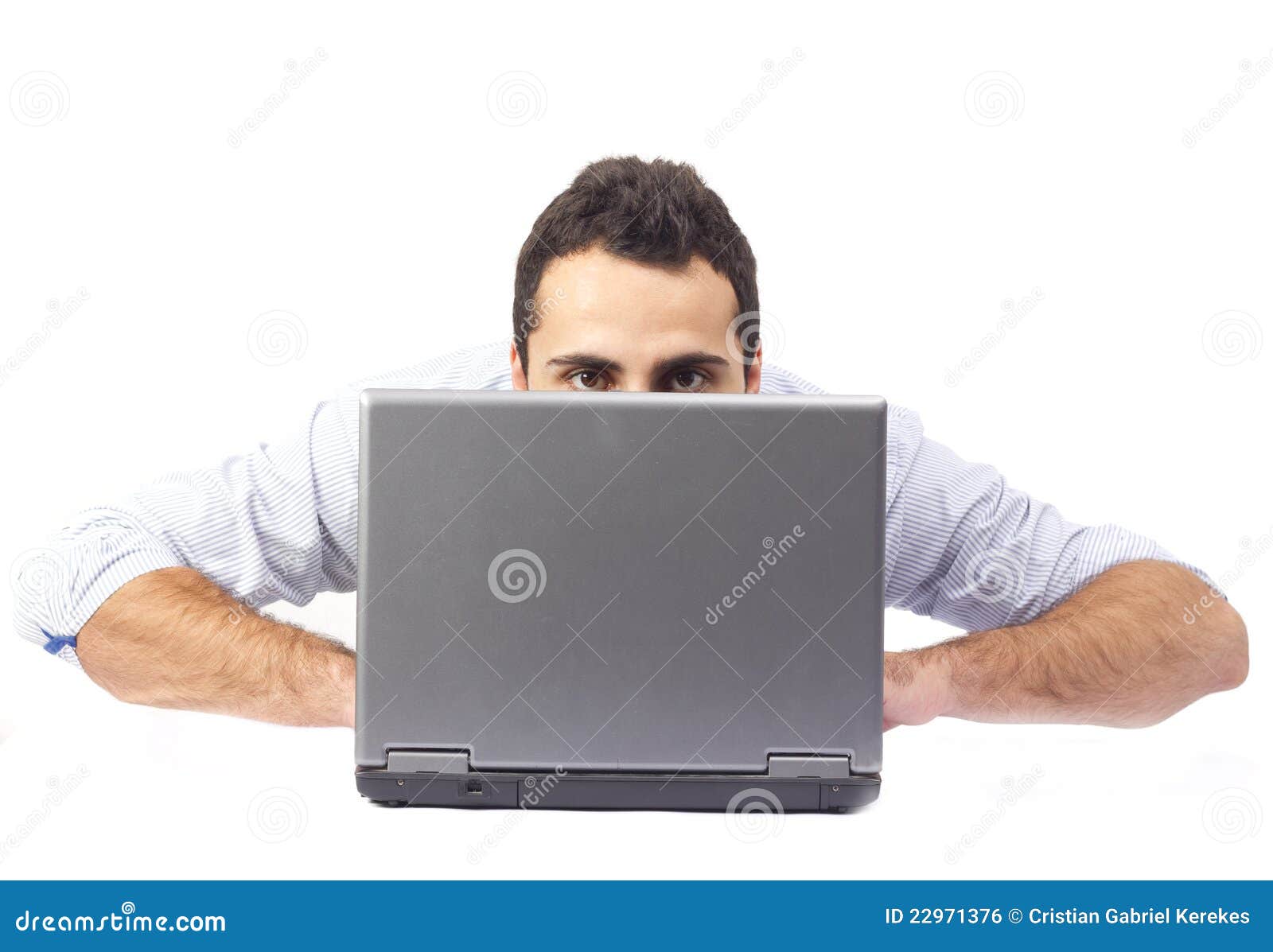 Young Man Behind A Laptop Royalty Free Stock Image - Image: 22971376