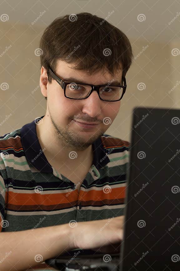 Young Man Behind a Laptop stock image. Image of friendly - 101397697