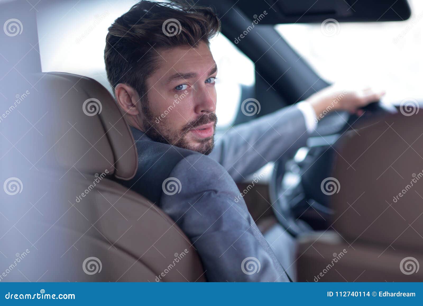 Successful Man Sitting Behind the Wheel of a Prestigious Car Stock ...