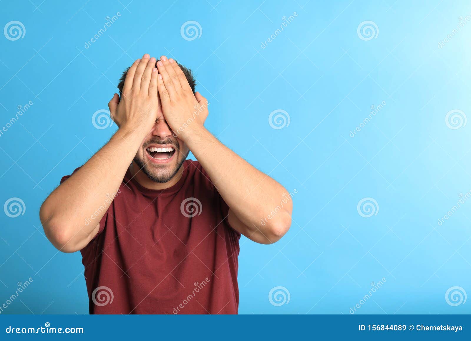 Young Man Being Blinded on Blue Background Stock Image - Image of close ...
