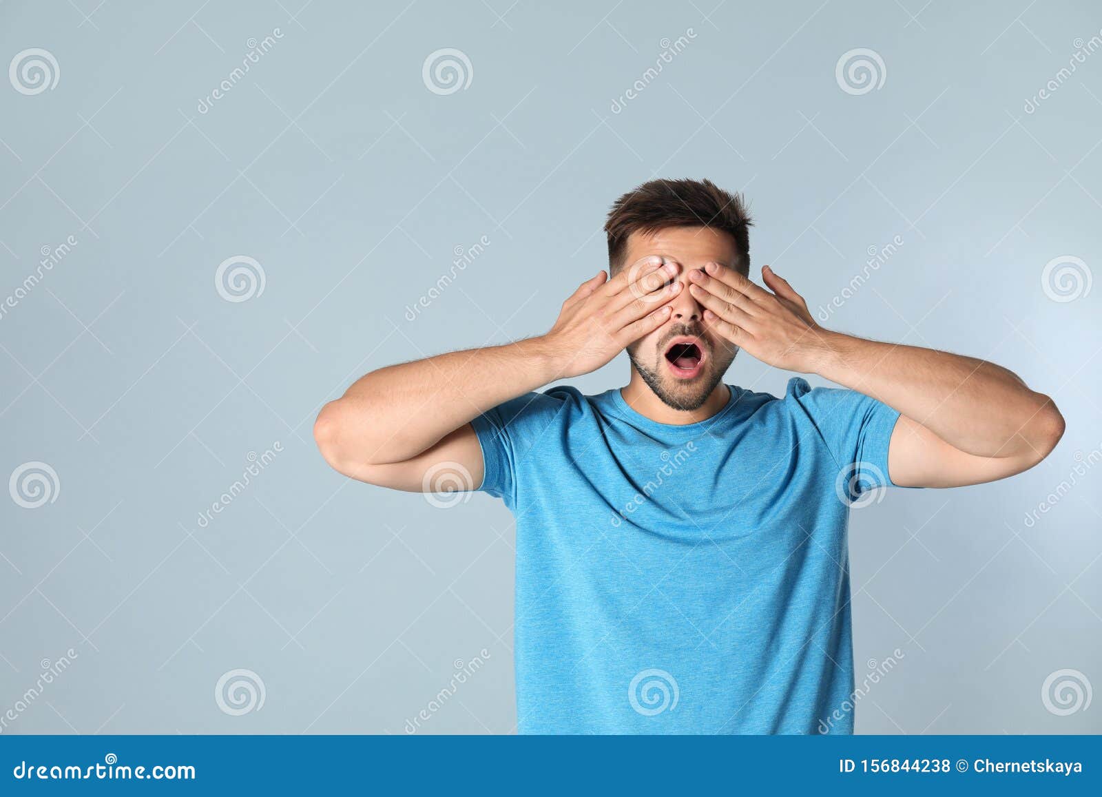 Young Man Being Blinded on Grey Background Stock Photo - Image of game ...
