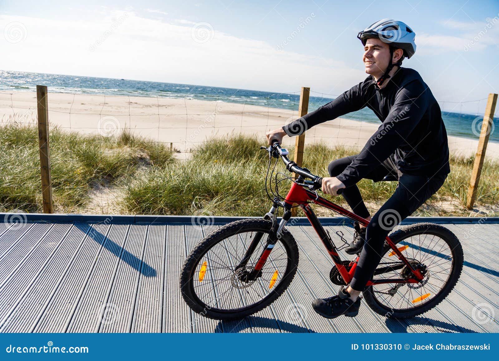 Young man biking stock photo. Image of beach, biking - 101330310