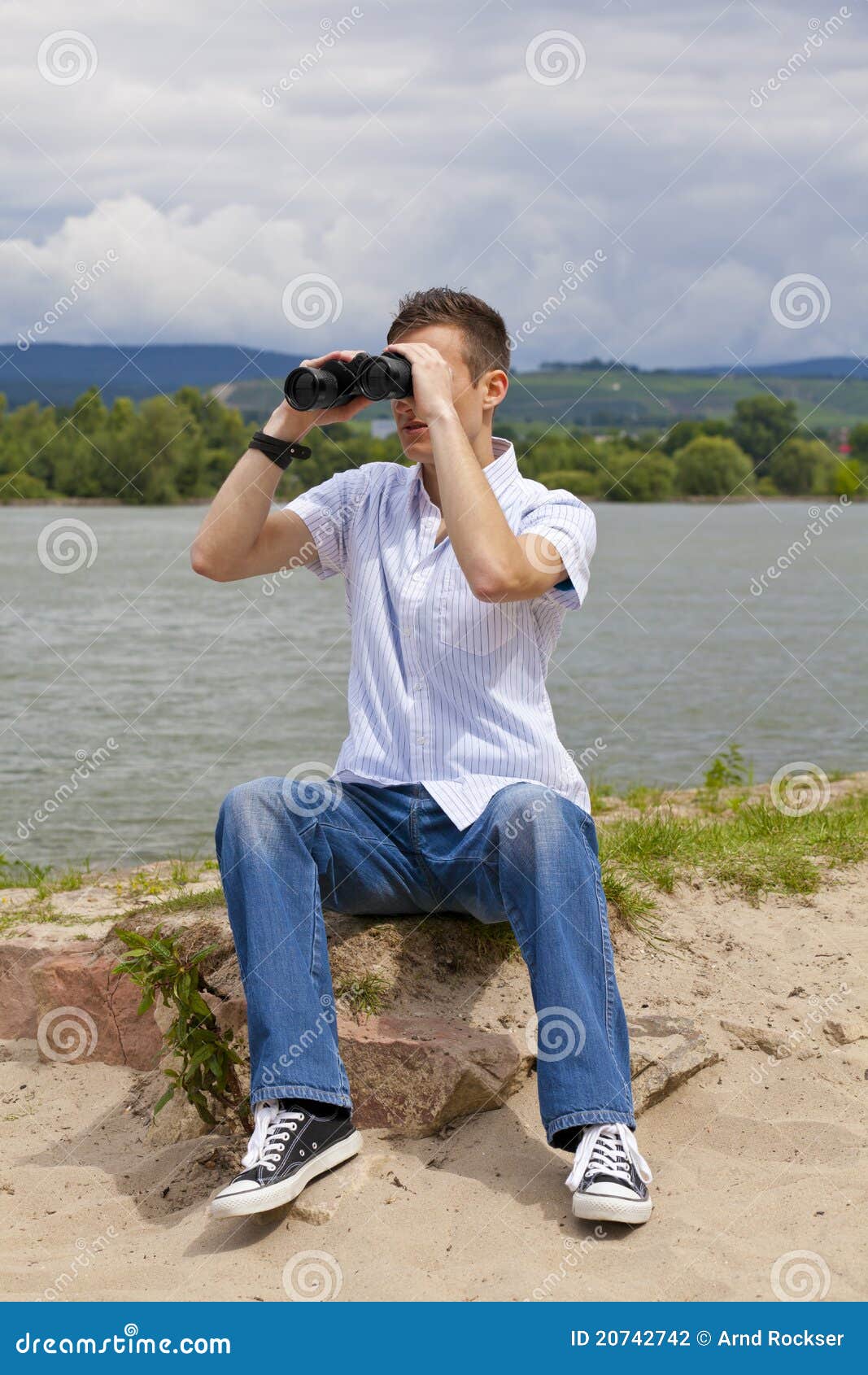 Young man with binoculars stock photo. Image of looking - 20742742