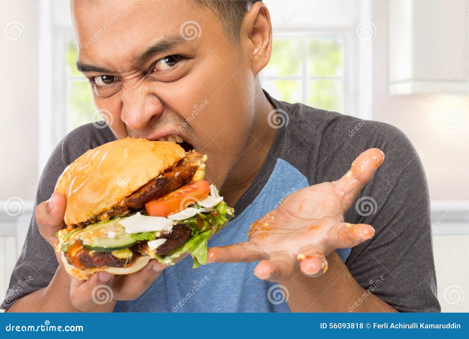 Young Man Bite His Big Burger Deliciously Stock Photo - Image of lunch ...