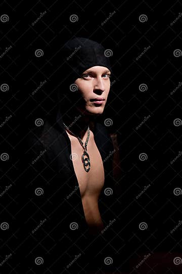 Young man in black cloack stock image. Image of dress - 12063607