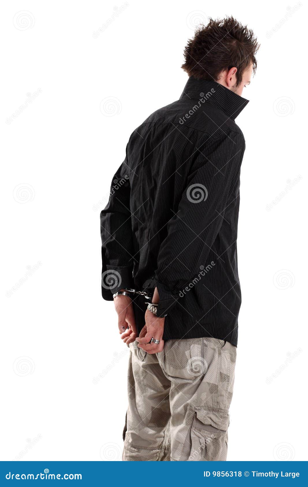 Young Man in Black Shirt with Handcuffs Stock Photo - Image of pose ...
