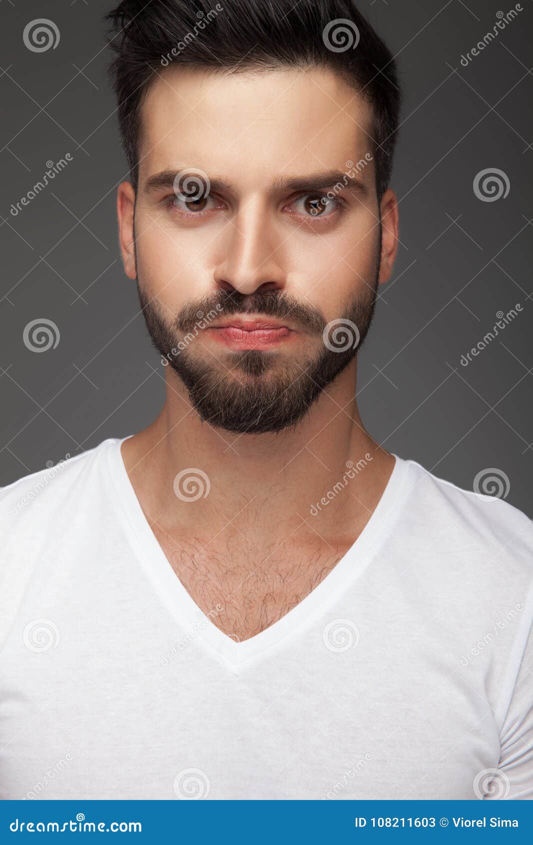 Young man blowing cheeks stock image. Image of brown - 108211603