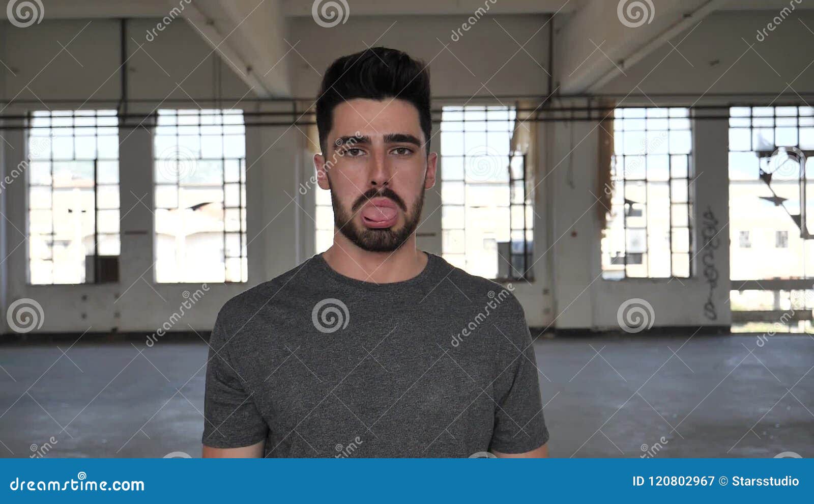 Young Man Blowing Raspberry To Camera Stock Video - Video of face ...