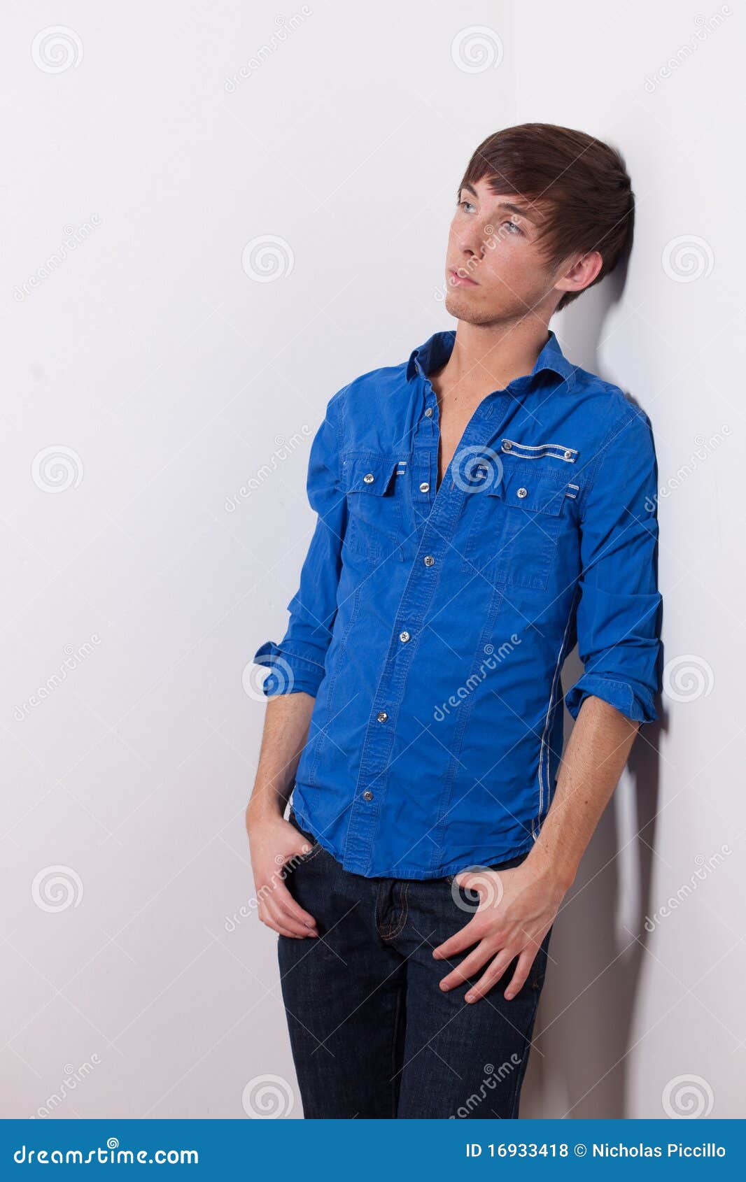 Young man in blue stock photo. Image of male, studio - 16933418