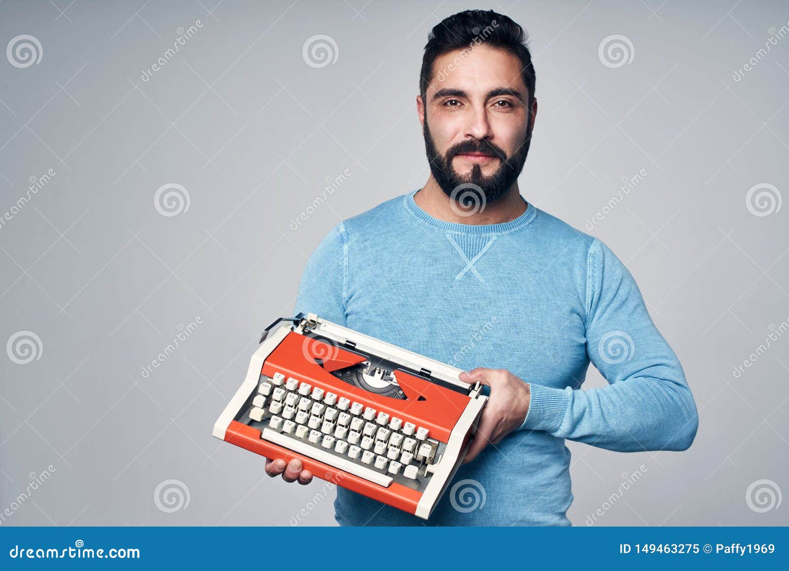 Young Man in Blue Pullover Standing Holding Retro Typewriter Stock ...