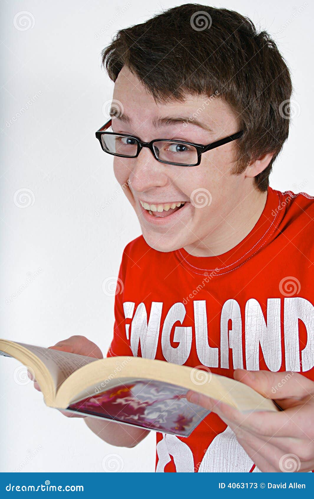 Young man with a book stock image. Image of elated, beaming - 4063173