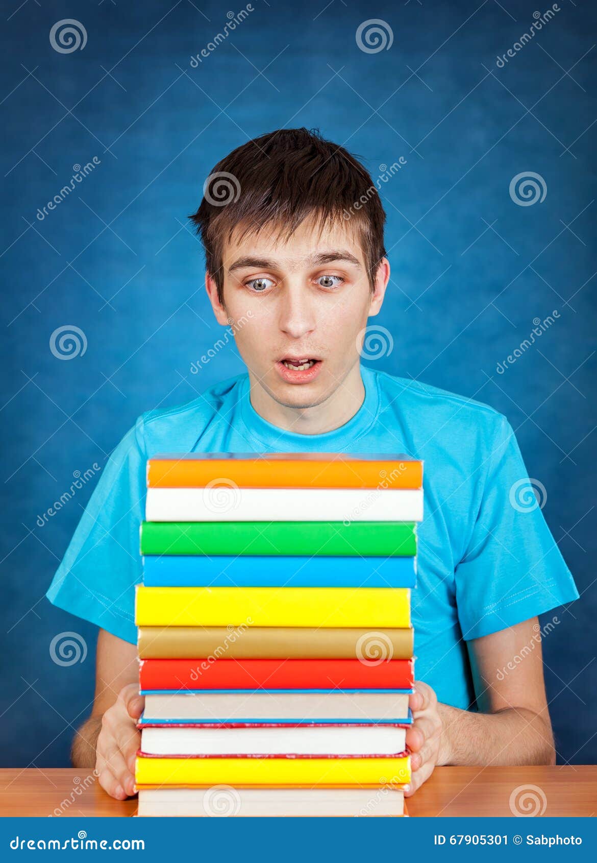 Young Man with the Books stock image. Image of male, heap - 67905301