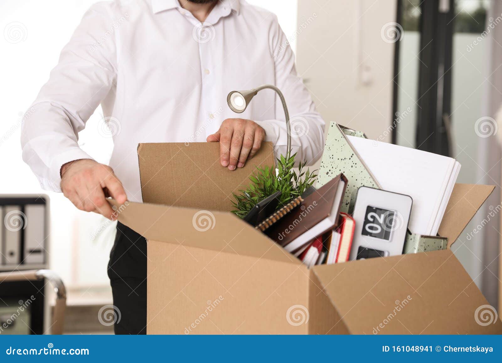Young Man with Box of Stuff in Office Stock Image - Image of light ...